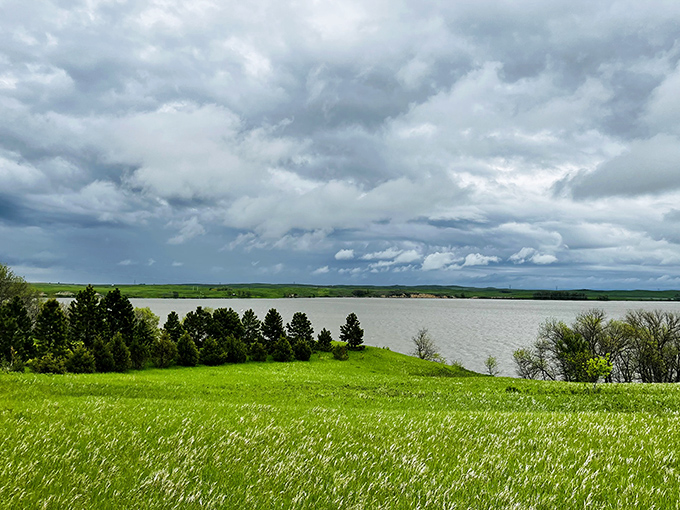 Storm clouds gather over Beaver Lake, creating a dramatic backdrop that makes even amateur photographers look like professionals.