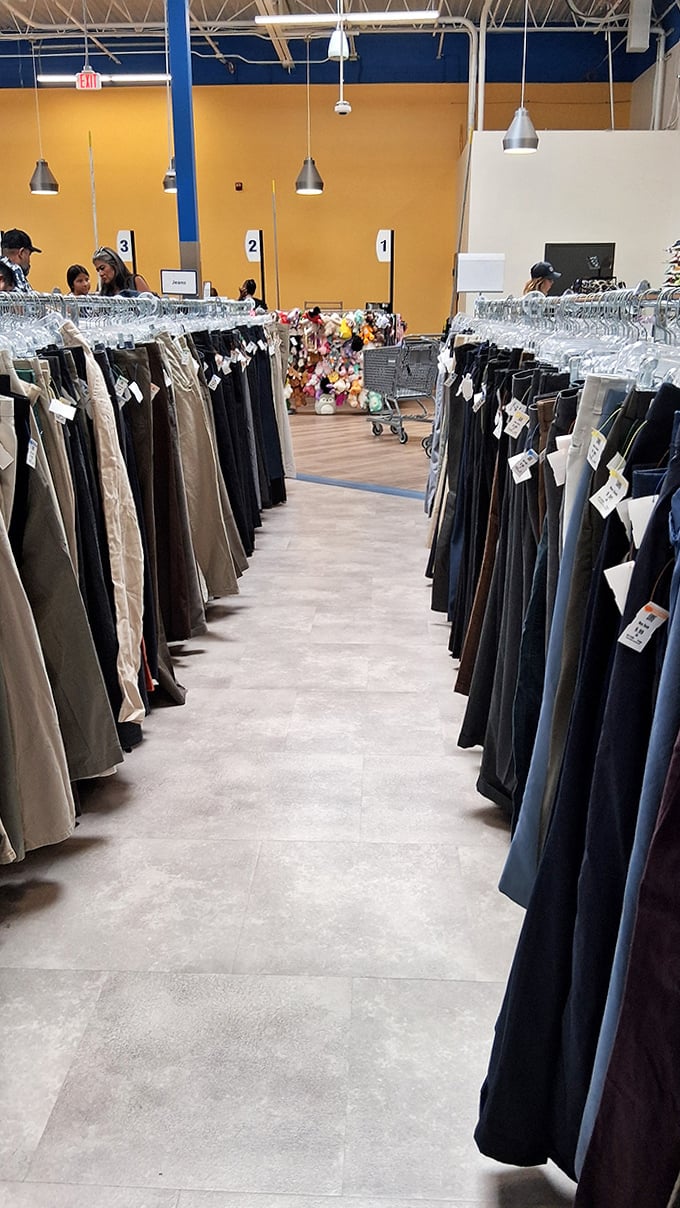 The pants section: where $7 can transform your wardrobe. Organized by size, these racks hold everything from casual denim to office-ready slacks.