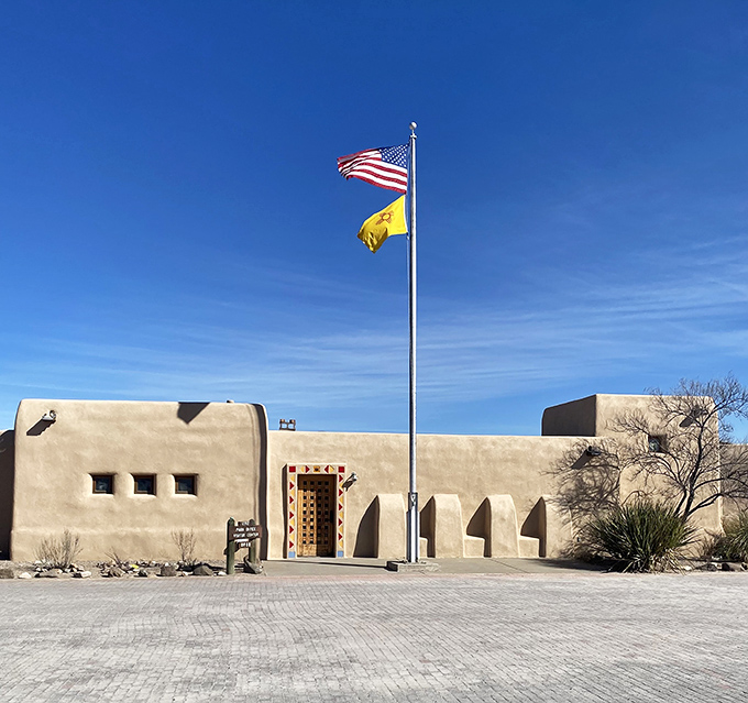 The visitor center's pueblo-style architecture blends perfectly with the landscape, like it grew right out of the New Mexico soil.