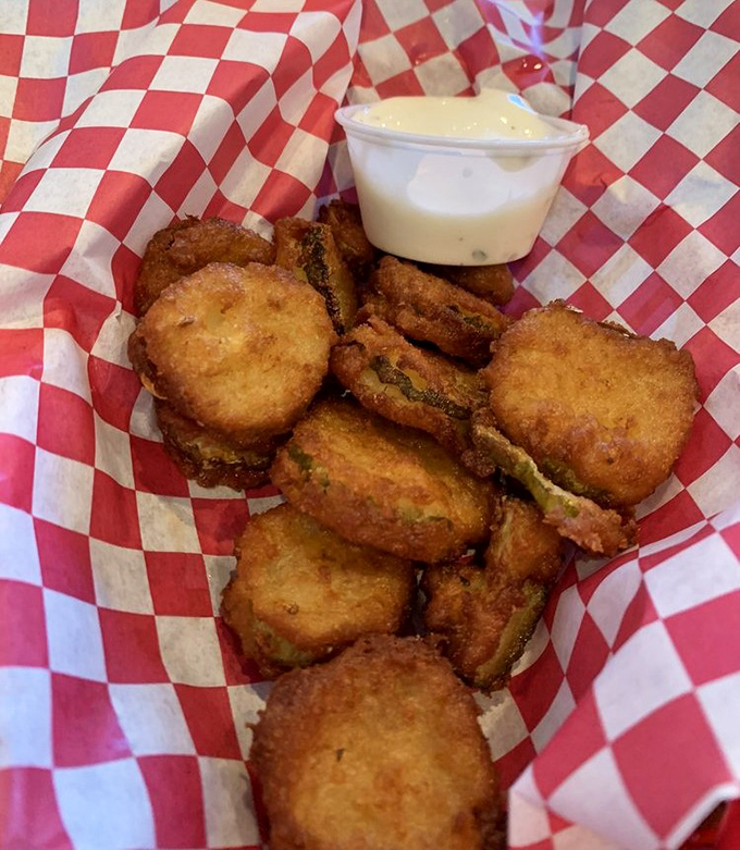 Golden-fried pickle chips with creamy ranch dressing offer the perfect salty, tangy starter for your breakfast feast adventure.