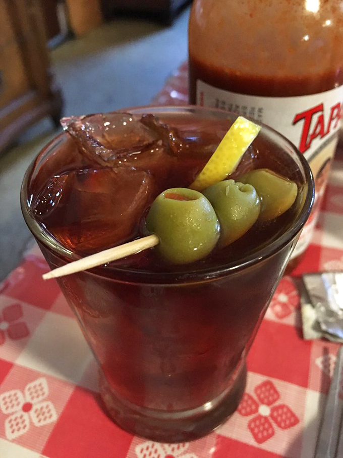 The Picon punch garnished with olives&mdash;a Basque-American cocktail that'll make you understand why people settle arguments over drinks.