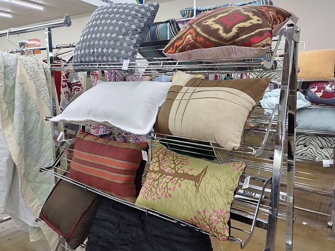 The pillow rack: a textile color wheel where someone's former living room accent becomes your couch's new best friend. Instant home makeover for pocket change.