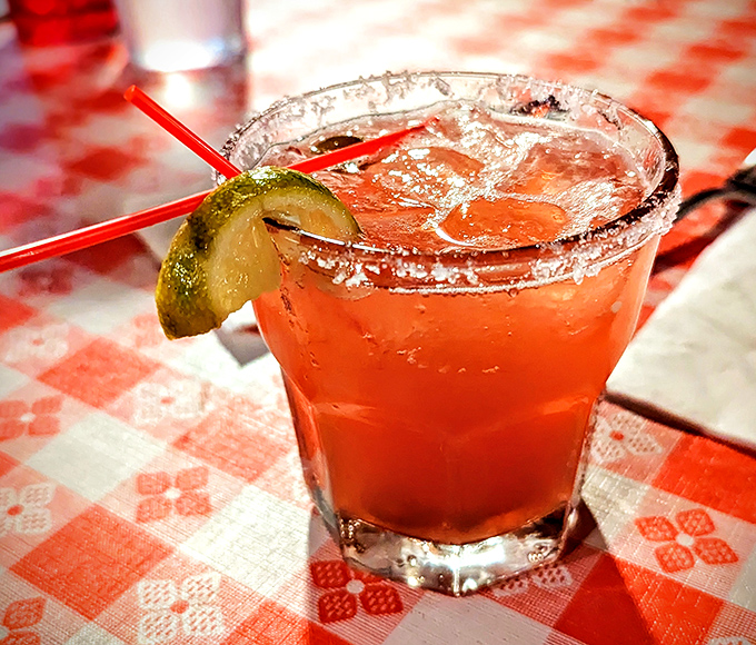 The Pinnacle Strawberry Jalape&ntilde;o Margarita: where sweet meets heat in a salt-rimmed glass of desert-inspired genius.