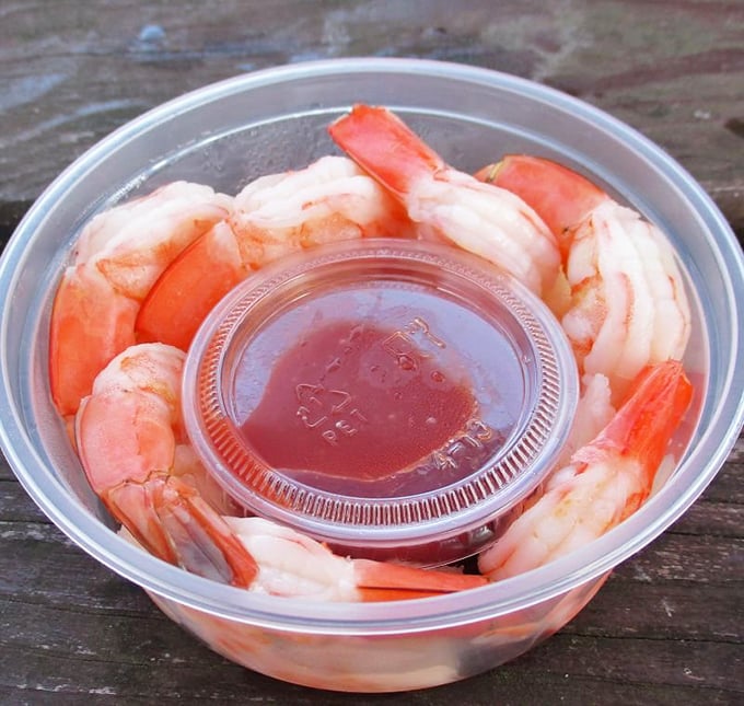 A ring of plump prawns standing at attention around their cocktail sauce companion&mdash;seafood's version of a perfect circle. 
