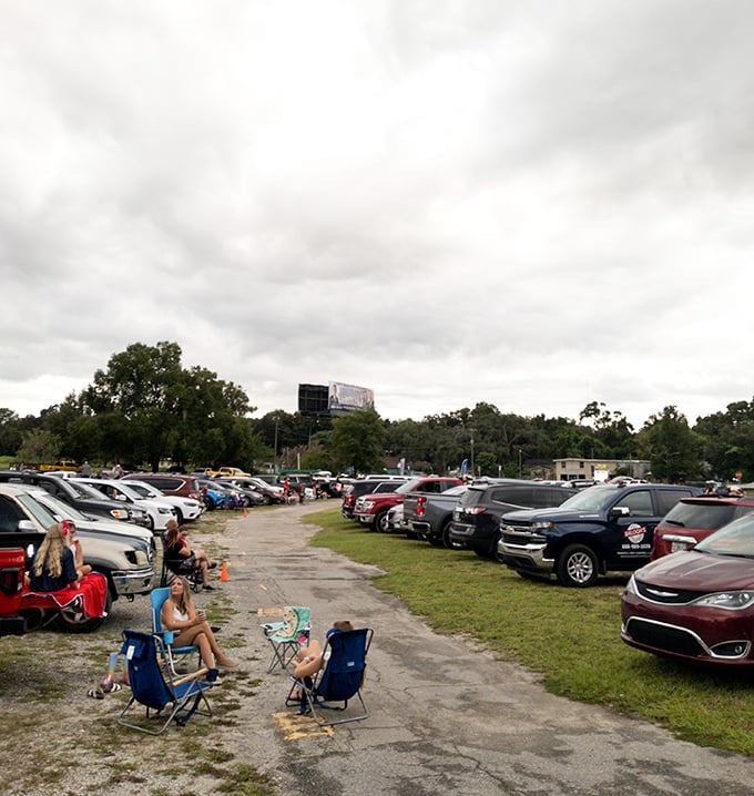 The concession stand bathed in pink sunset light&mdash;where movie memories are made of buttery popcorn and cold drinks under Florida skies.