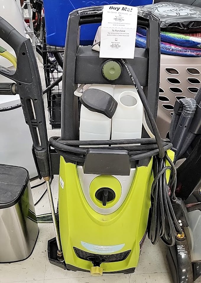 A lime green pressure washer stands at attention, ready to blast away both dirt and buyer's remorse.