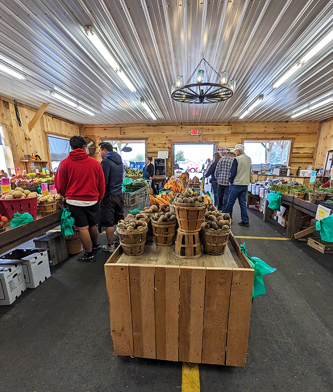 Farm-fresh produce displayed in rustic wooden baskets—the perfect complement to a day of hunting for treasures manufactured long before planned obsolescence.