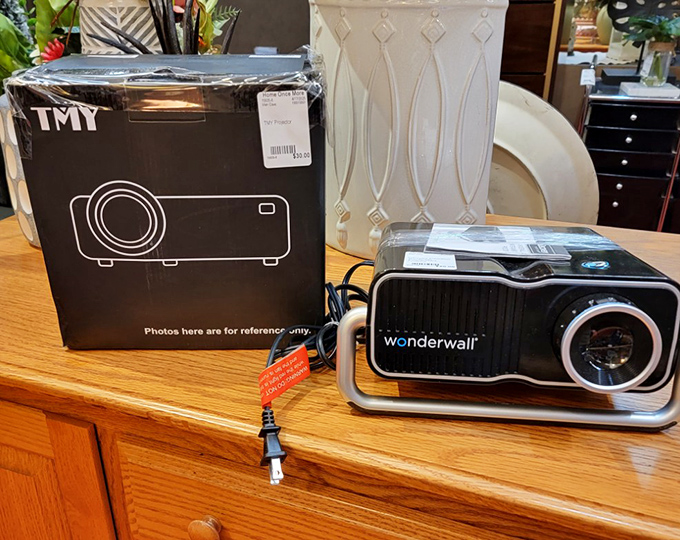 Technology gets a second chance too! This projector might have once showcased corporate PowerPoints but now awaits backyard movie nights under the stars.