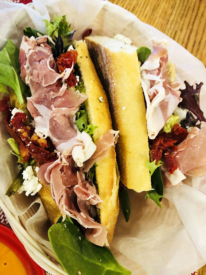 A baguette sandwich that transports you straight to a Parisian café, with prosciutto, greens, and sun-dried tomatoes playing perfect harmony.