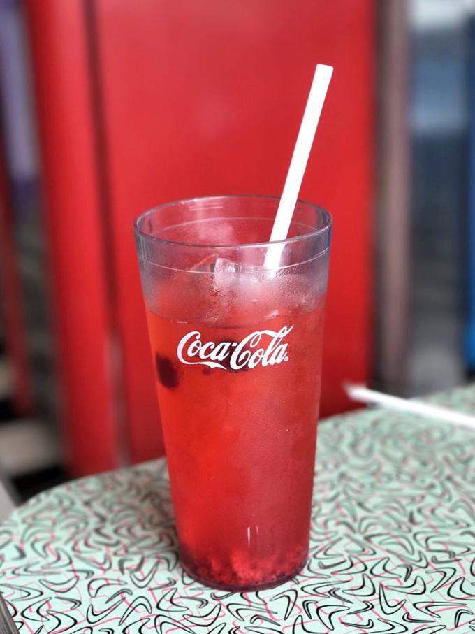 That raspberry lemonade hits different when served in a proper diner glass with a bendy straw.