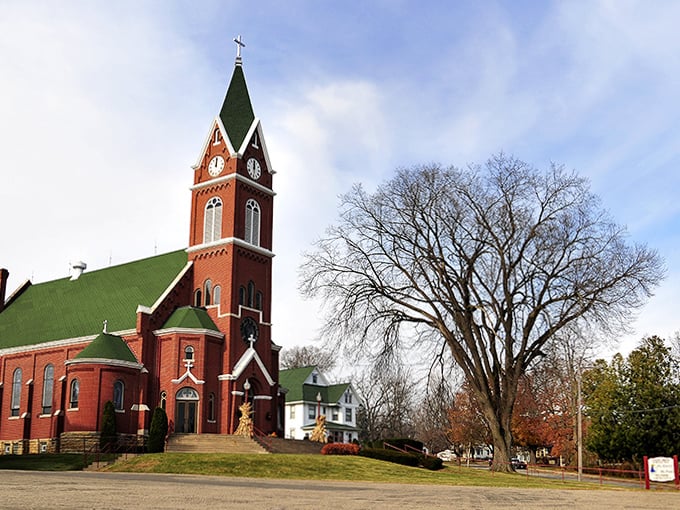 The red brick church reaches skyward with its impressive spire, a spiritual landmark that's been photobombing family pictures for generations.