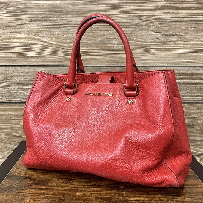 That red Michael Kors bag isn't just an accessory &ndash; it's the confidence boost you didn't know you needed for about a tenth of retail.
