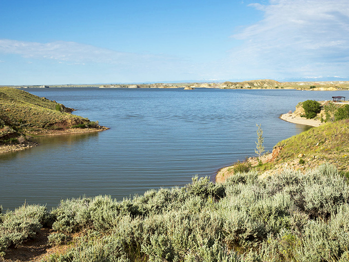 Boysen Reservoir stretches toward the horizon, its blue waters creating an oasis that draws anglers, boaters, and sunset-chasers from across Wyoming.