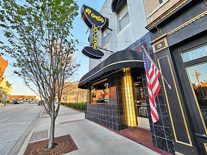 Library interiors offer quiet refuge and actual books, revolutionary concepts in our notification-obsessed world.