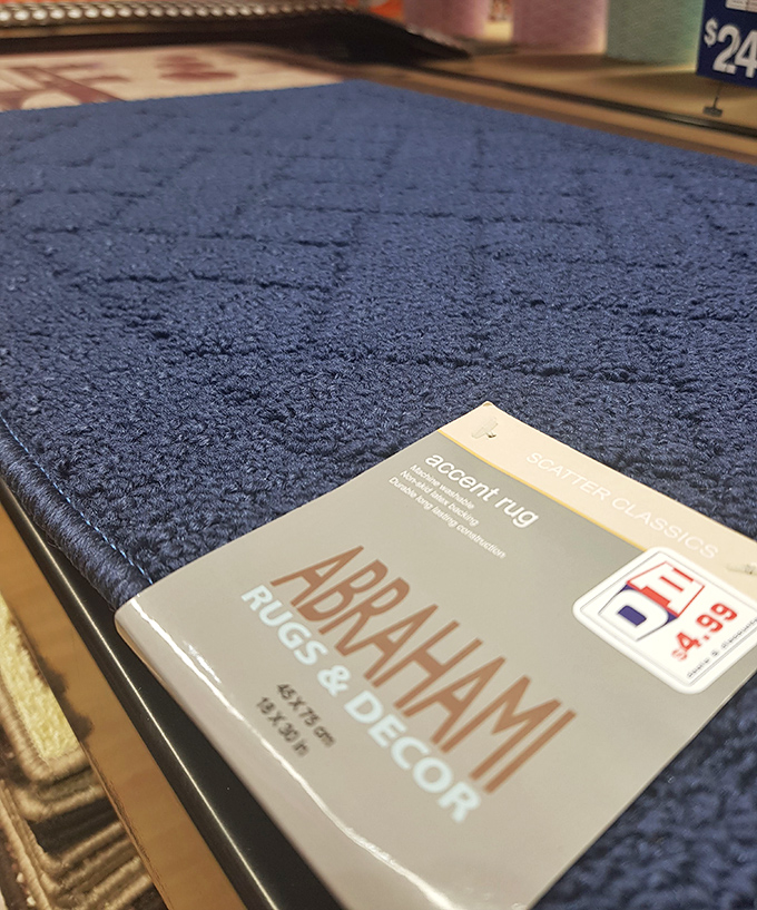 That blue accent rug isn't just affordable decor&mdash;it's the difference between "this apartment" and "MY apartment" for under five bucks.