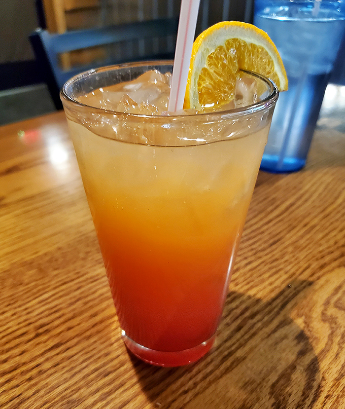 A sunset in a glass: this layered cocktail promises to ease you into your evening of indulgence with fruity persuasion.