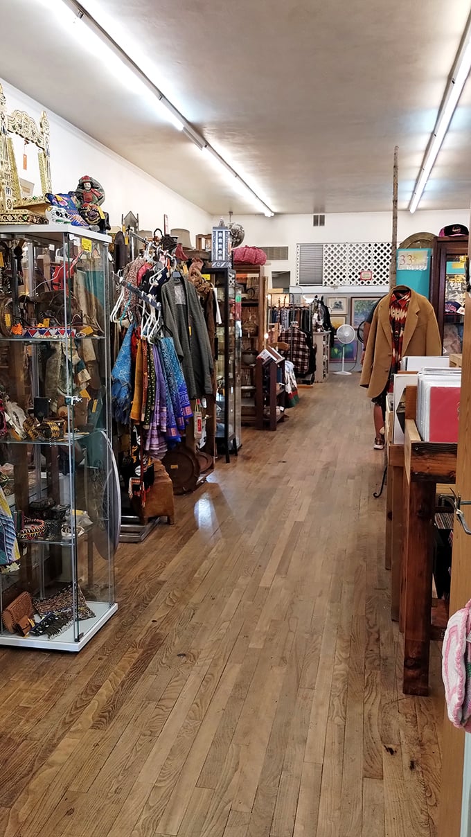 An aisle that whispers "come get lost in me" with its wooden floors and carefully curated collections. Vintage clothing waiting for its second act.