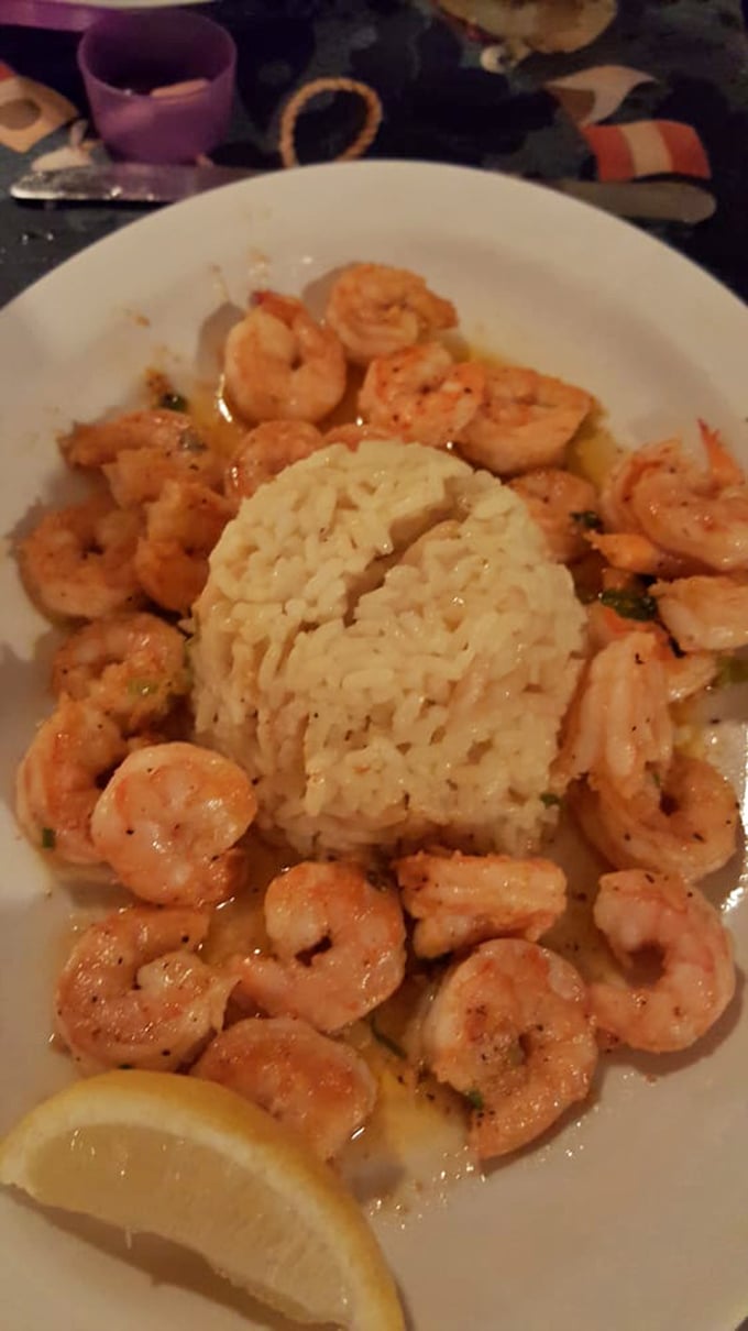 Saut&eacute;ed shrimp circling that rice like they're protecting treasure, which honestly, they kind of are at this point.