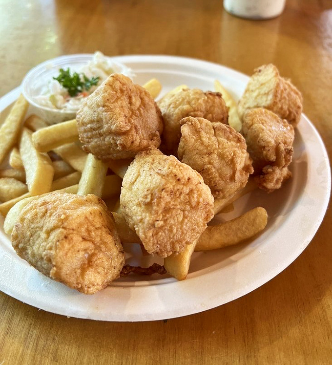 Golden-fried scallops that pop with sweetness inside their crispy armor. The ocean's candy, served with a side of nostalgia.