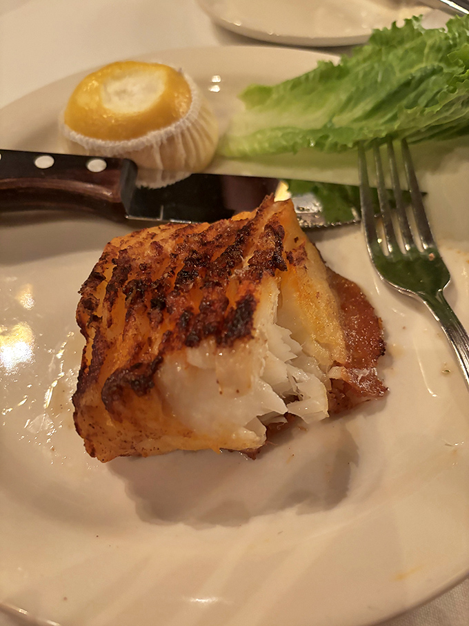 The perfectly flaky sea bass proves that while steaks may be the headliner, the seafood deserves its own standing ovation.