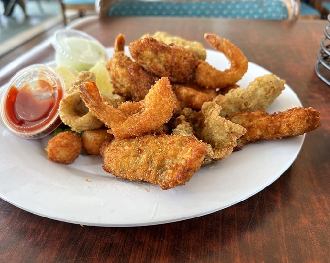 The fried seafood platter—where "diet" goes to die happily. Golden, crispy treasures from the deep that make calories worth counting.