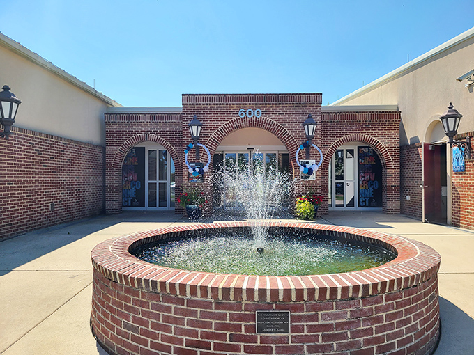 The Seaford District Library courtyard welcomes readers with a soothing fountain. A peaceful spot to enjoy your latest mystery novel while pretending to contemplate something profound.