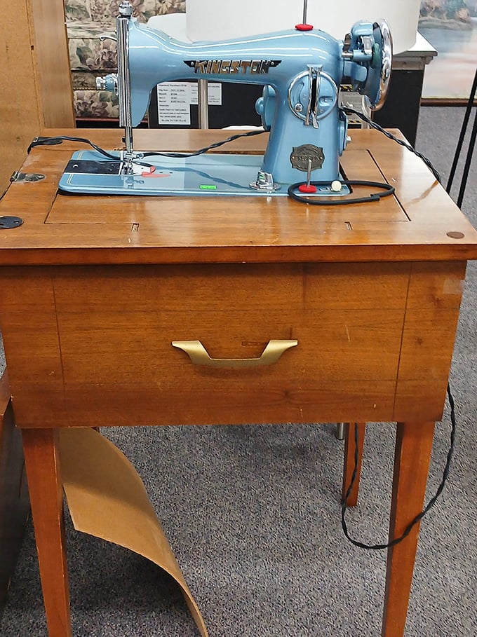 A classic sewing machine mounted in its original cabinet, built during an era when things were actually designed to last forever.