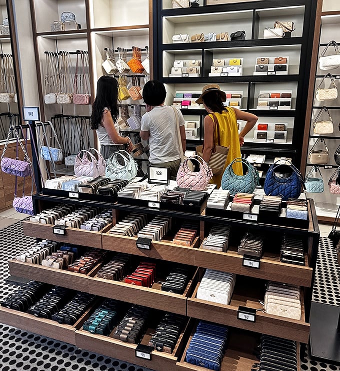 Handbag hunters in their natural habitat. The focused concentration of shoppers on the prowl for the perfect designer deal.