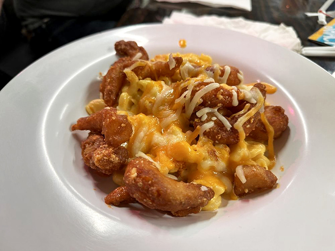 Mac and cheese that's had a glow-up with golden fried shrimp—comfort food that's gone to finishing school and graduated with honors.