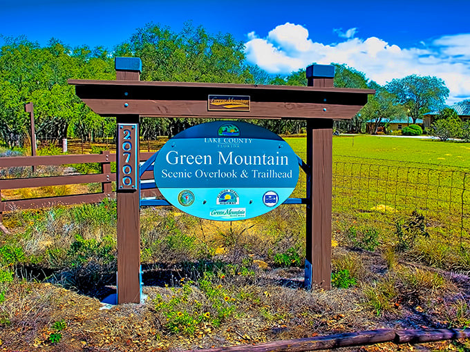 Not just any park entrance&mdash;this is the gateway to Florida's elevation sensation. The blue sign promises adventure ahead.