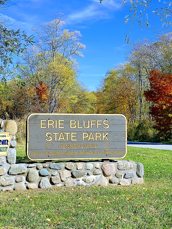 The understated welcome sign that marks the boundary between ordinary life and extraordinary natural beauty.