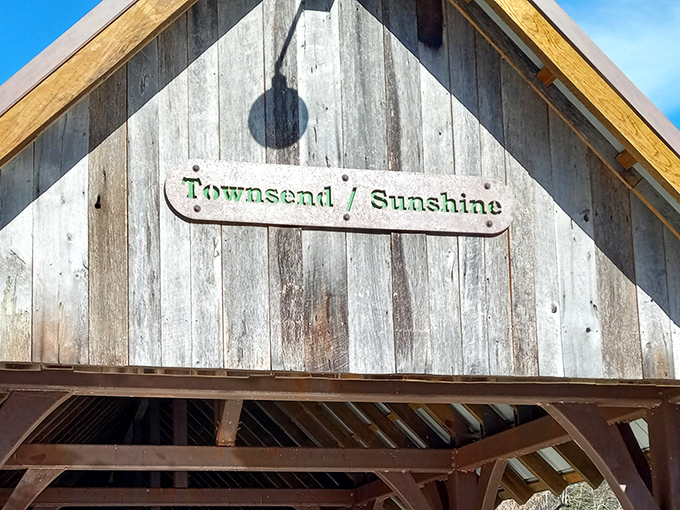 The rustic wooden sign announces "Townsend/Sunshine" with understated charm, like a friendly neighbor who doesn't need to shout to be noticed.