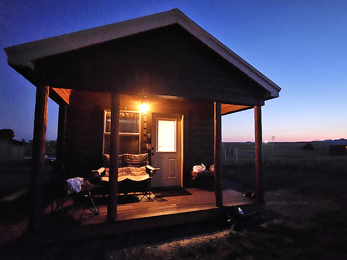 As twilight embraces this rustic cabin, you can almost hear the day's fishing stories growing taller with each passing minute.