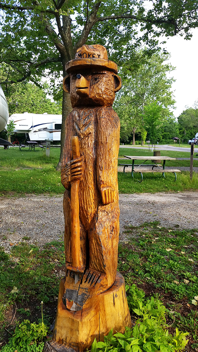 Smokey Bear's wooden doppelgänger stands guard at the campground. This carved sentinel reminds campers that only they can prevent forest fires—with style.
