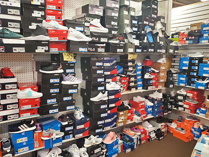 Sneakerhead nirvana! This wall of boxed athletic footwear proves that one person's overstock is another's fashion statement.