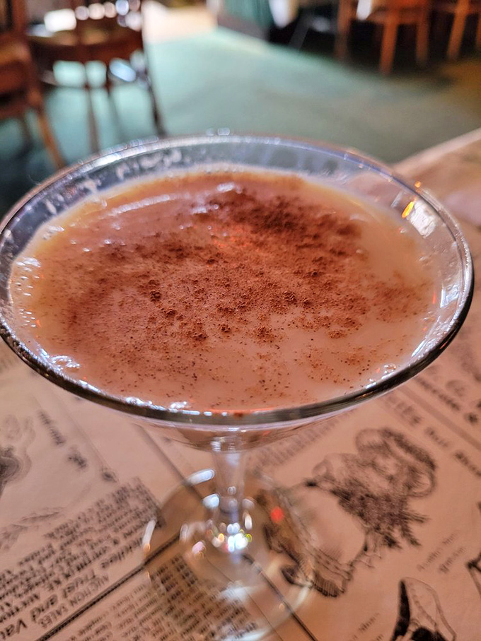 A martini with just enough spice to remind you you're alive, dusted with cinnamon like autumn in a glass.
