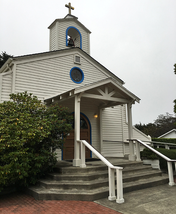 St. Anthony's Church welcomes visitors with distinctive blue-trimmed windows &ndash; architectural details that whisper rather than shout their coastal charm.