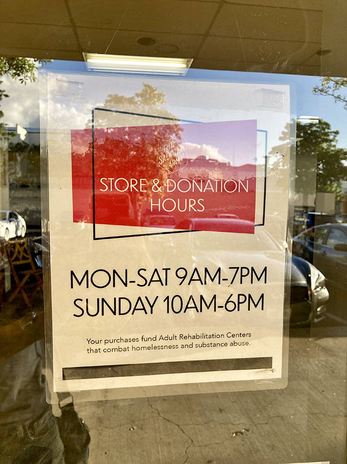 The store hours sign reminds shoppers that their bargain hunting also funds vital community programs. Shopping with purpose never looked so good!