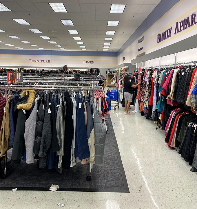 The apparel section stretches toward infinity, where winter coats and summer dresses coexist in climate-defying harmony.