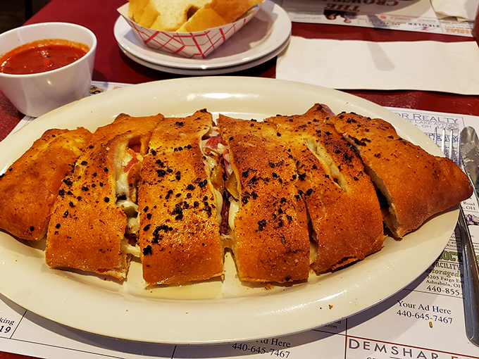 This stromboli isn't just a meal, it's an event. Sliced to reveal its treasure trove of fillings, with marinara standing by for dunking duty.