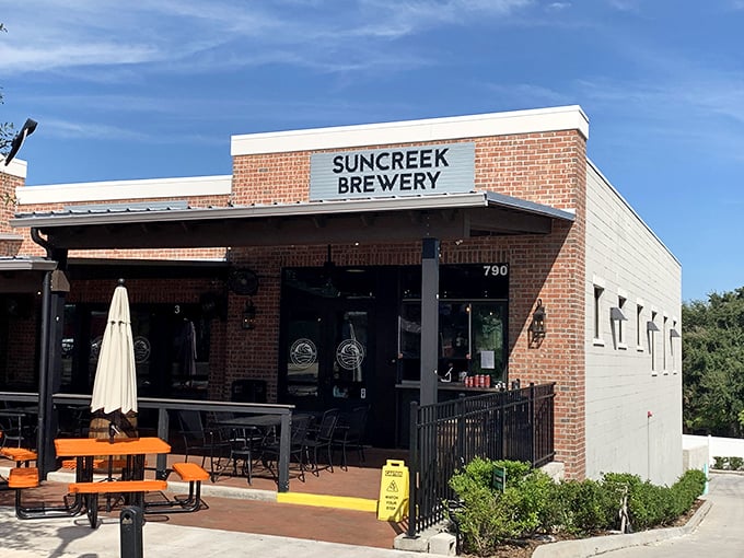Suncreek Brewery's modern brick facade promises craft beer adventures in downtown Clermont's evolving culinary scene.