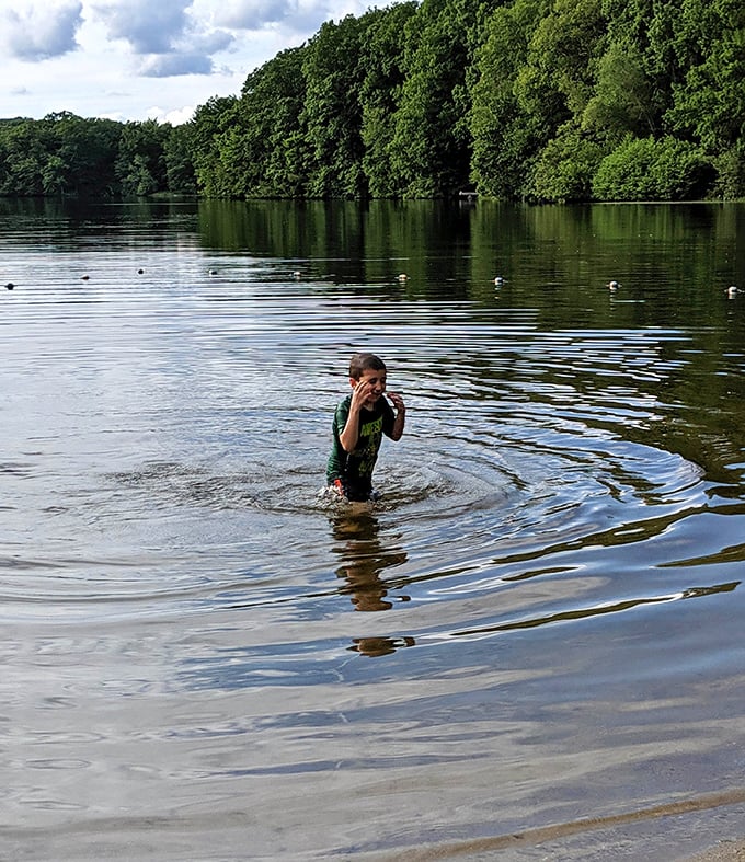 Simple childhood joys remain unchanged at Nystrom's Pond, where splashing costs nothing but creates memories worth everything.