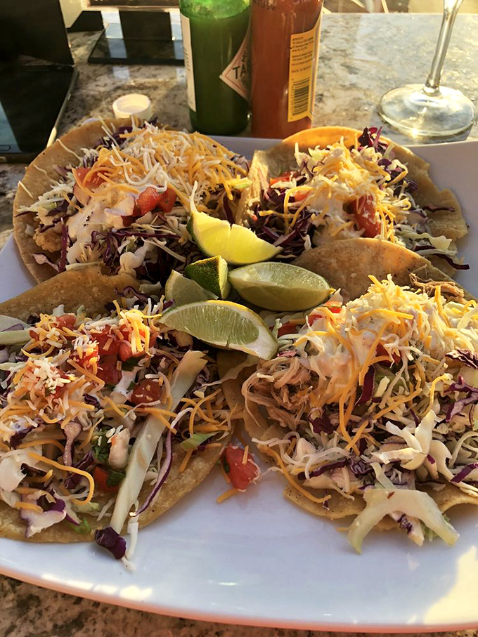 Tacos that tell a story of two worlds colliding &ndash; ocean bounty meets land-based happiness with every colorful, cheese-topped bite.