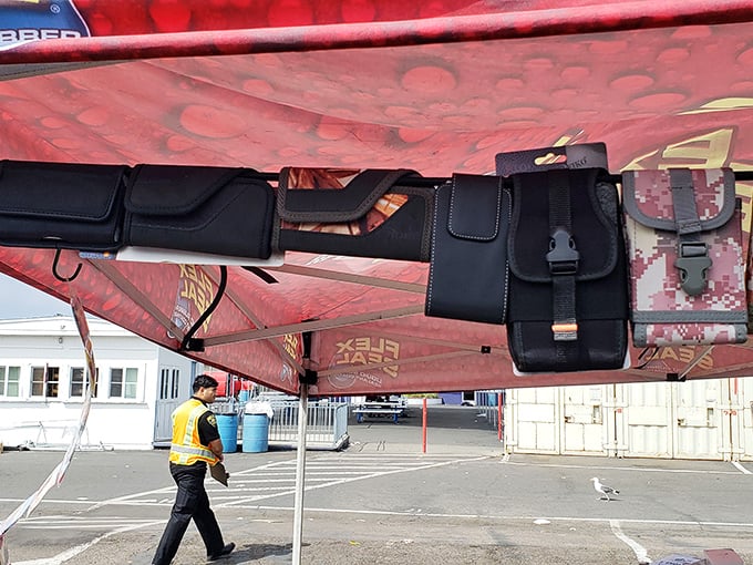 Tactical accessories hang like urban fruit, ready to be plucked by outdoor enthusiasts or those who just want to look prepared for anything.