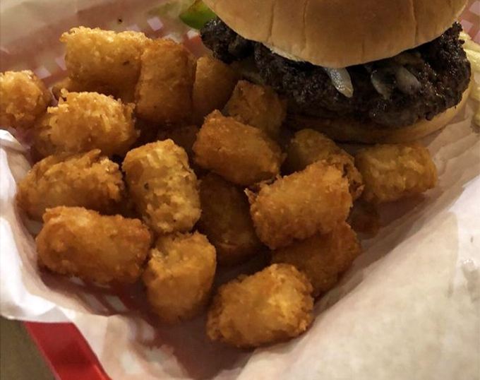 Tater tots nestled beside a burger &ndash; it's like your childhood and adulthood shaking hands over lunch.