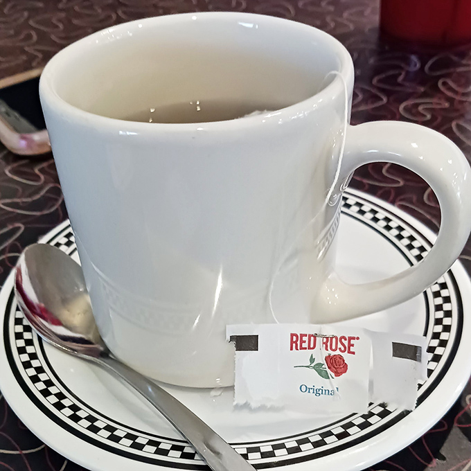 The universal diner coffee experience: simple white mug, checkered saucer, and Red Rose tea packet standing by for non-coffee drinkers. 