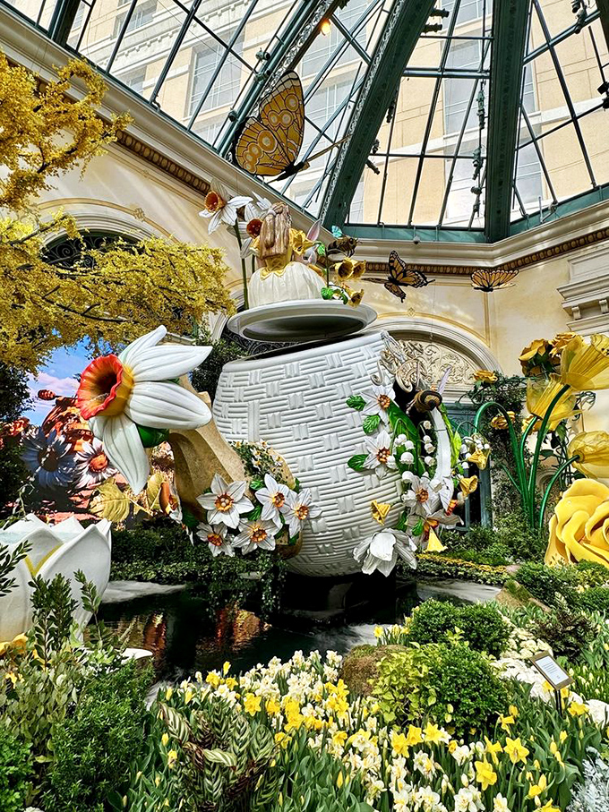 Giant butterflies hover near this magnificent teapot, ready to pour imagination into the garden's already dreamlike atmosphere.