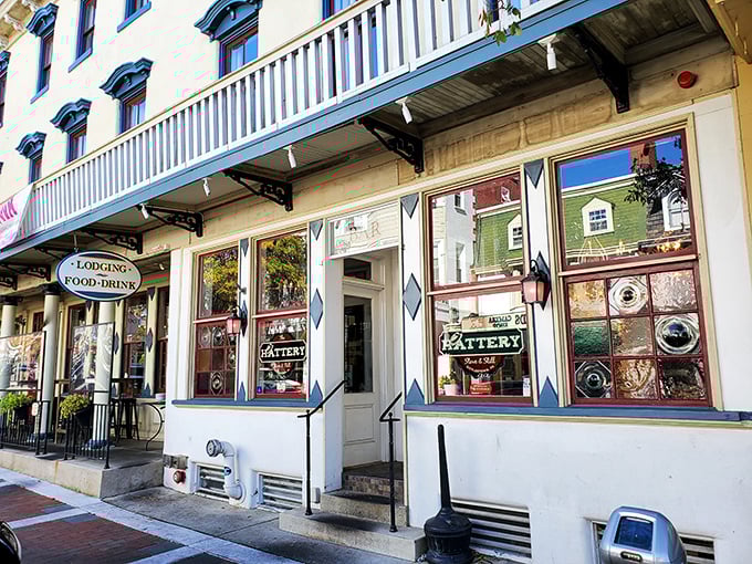 The Hattery Stove & Still's vintage storefront promises the kind of dining experience where the ambiance is as carefully crafted as the cocktail menu.