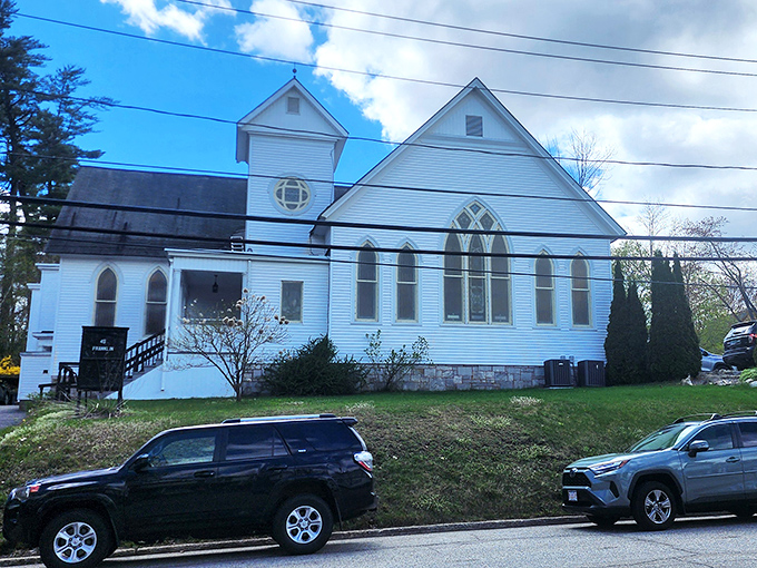 This repurposed white church proves that in small-town Maine, sacred spaces find new life while preserving the architectural soul of the community.