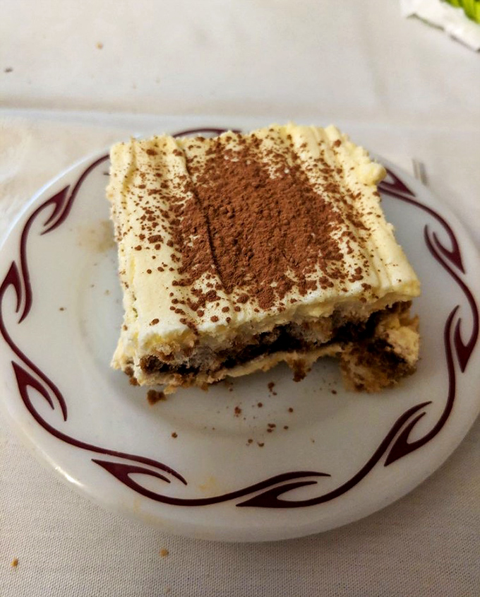 Tiramisu that strikes the perfect balance between coffee-soaked decadence and cloud-like mascarpone—a sweet finale that's never too sweet.